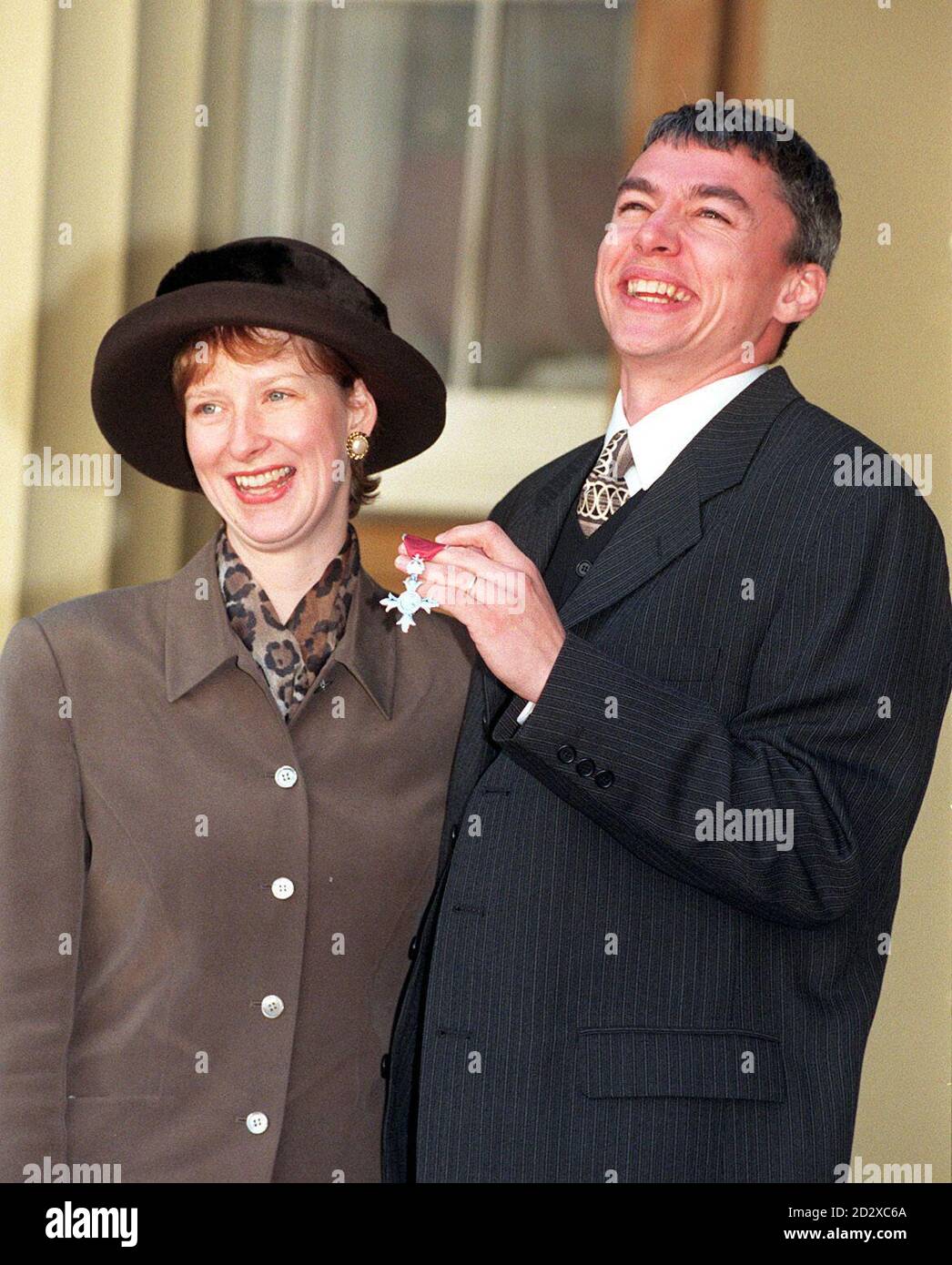 Triple Jumper Jonathan Edwards stands with his wife Alison as he ...