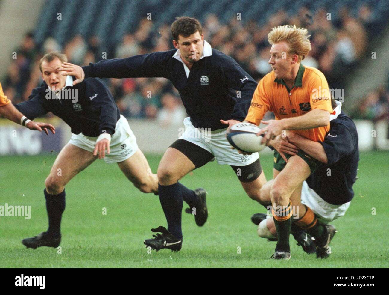Australia's David Knox makes a break through the Scottish defence ...