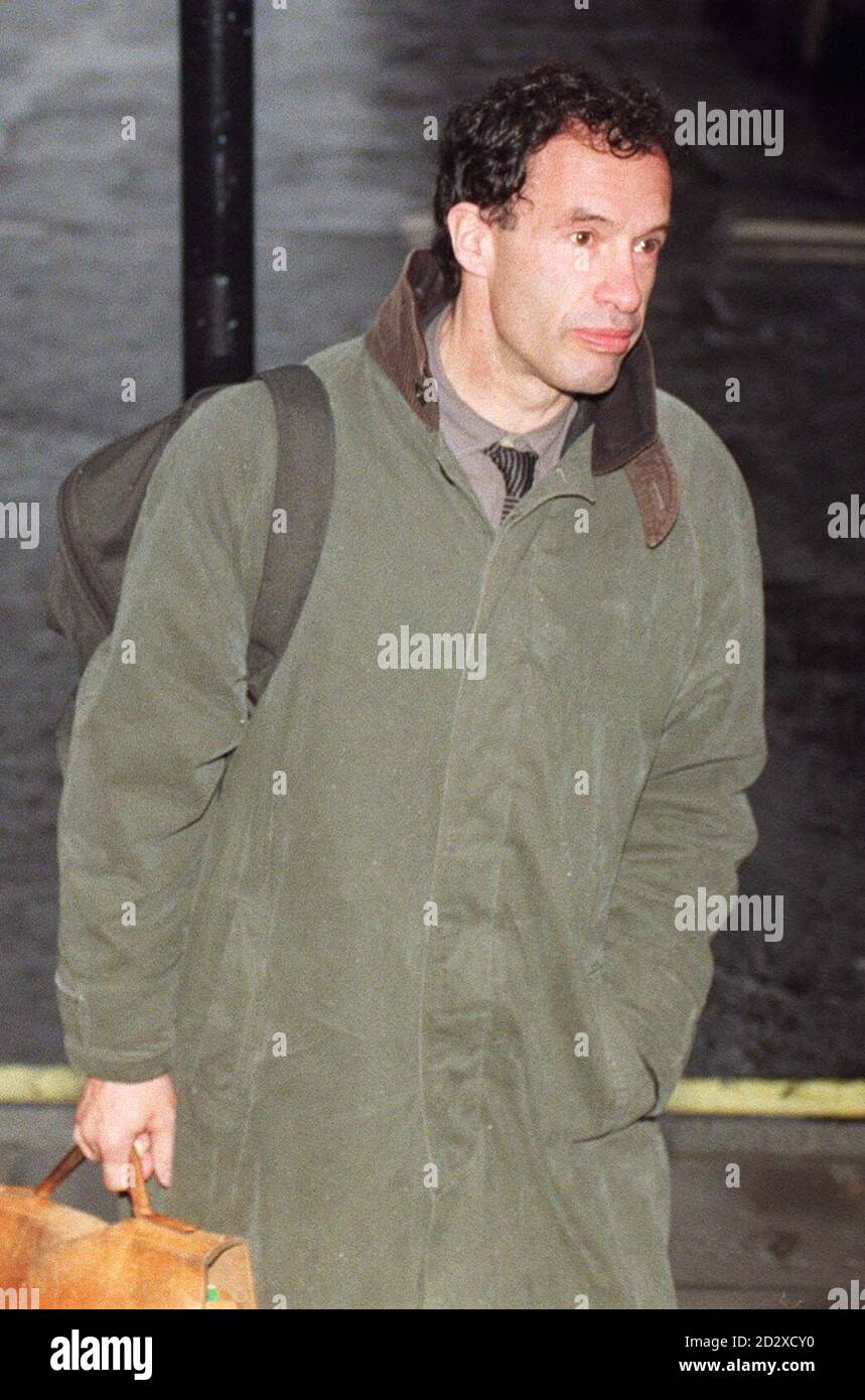 University lecturer Robert Fine arrives at the High Court in London ...