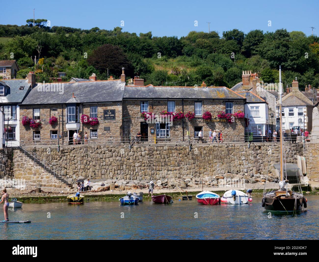 The Ship Inn overlooks the harbour at Mousehole in Cornwall Stock Photo ...