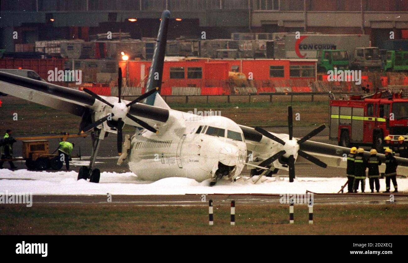 A KLM Fokker 50 plane sits on the South Runway at Heathrow Airport ...