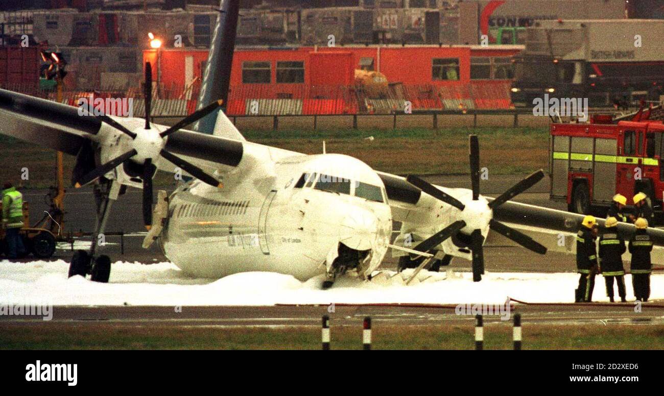 A KLM Fokker 50 plane sits on the South Runway at Heathrow Airport ...