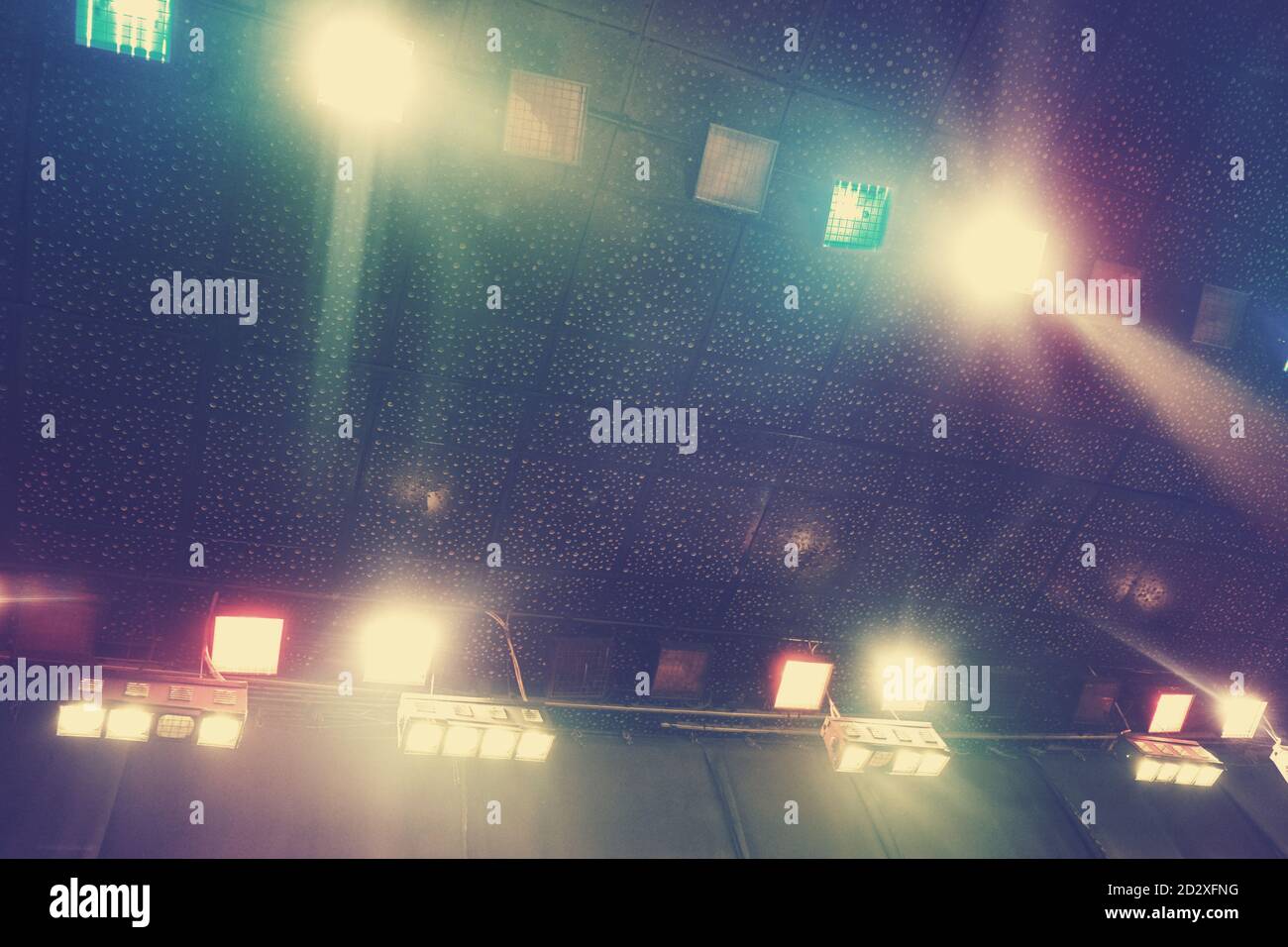Stage lighting lamps in the concert hall, spotlights at a music concert ...
