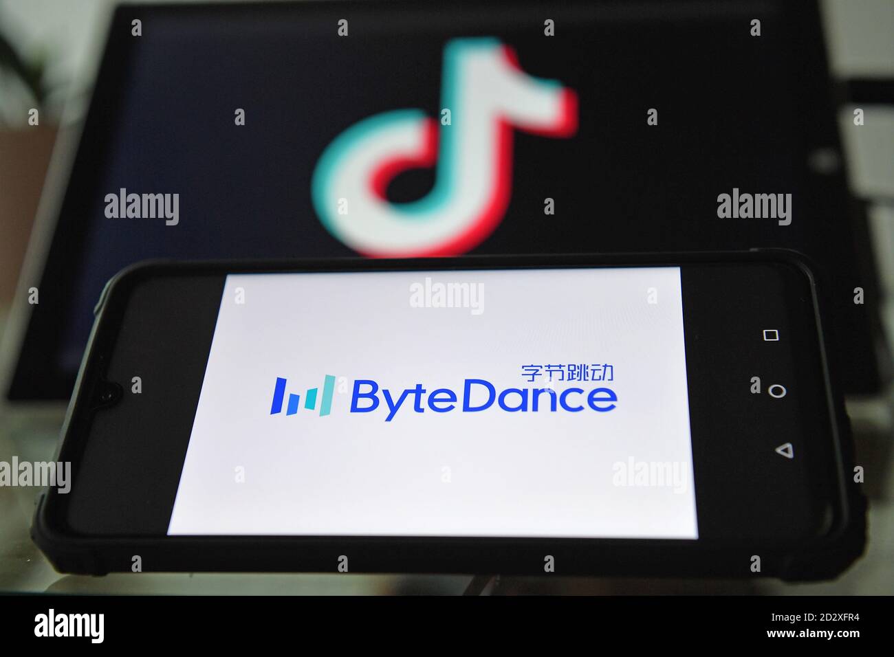 TikTok and ByteDance logos displayed on screens in London, UK Stock ...
