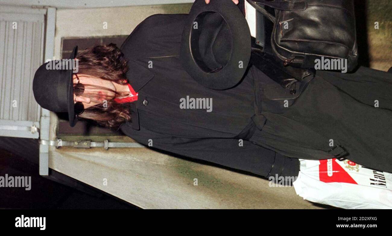 Michael Jackson's mystery travelling companion pictured arriving at ...