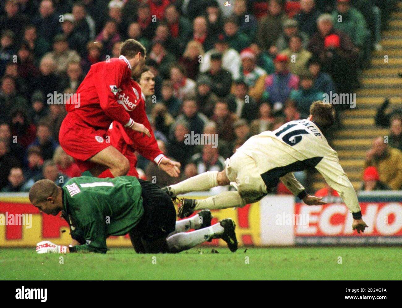 Liverpool's keeper David James (left) saves at the feet of West Ham's ...
