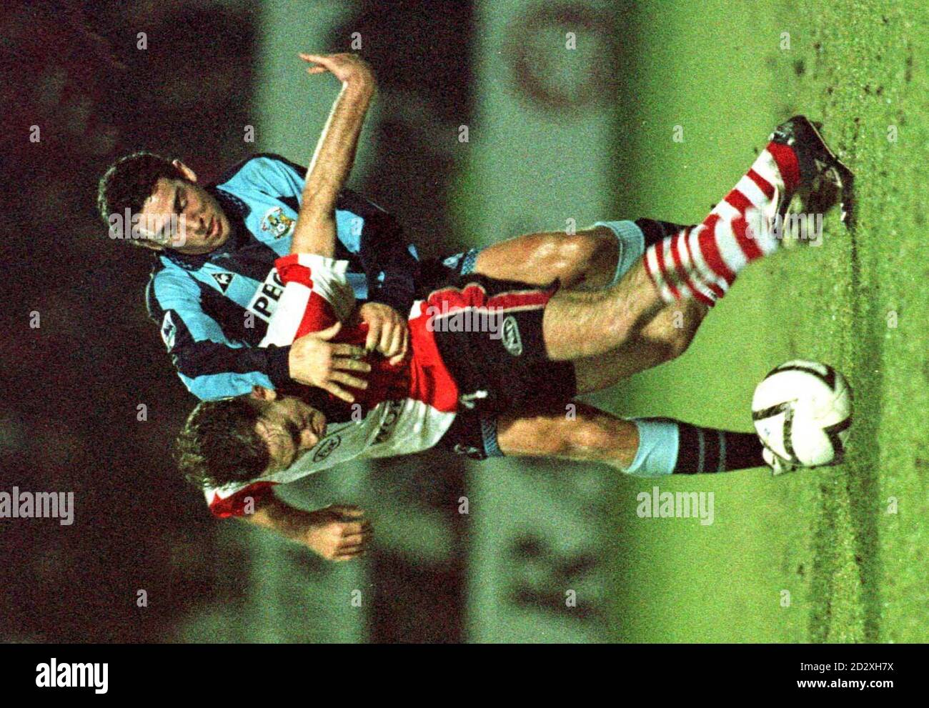 Woking's Robin Taylor and Paul Telfer of Coventry during the FA Cup ...
