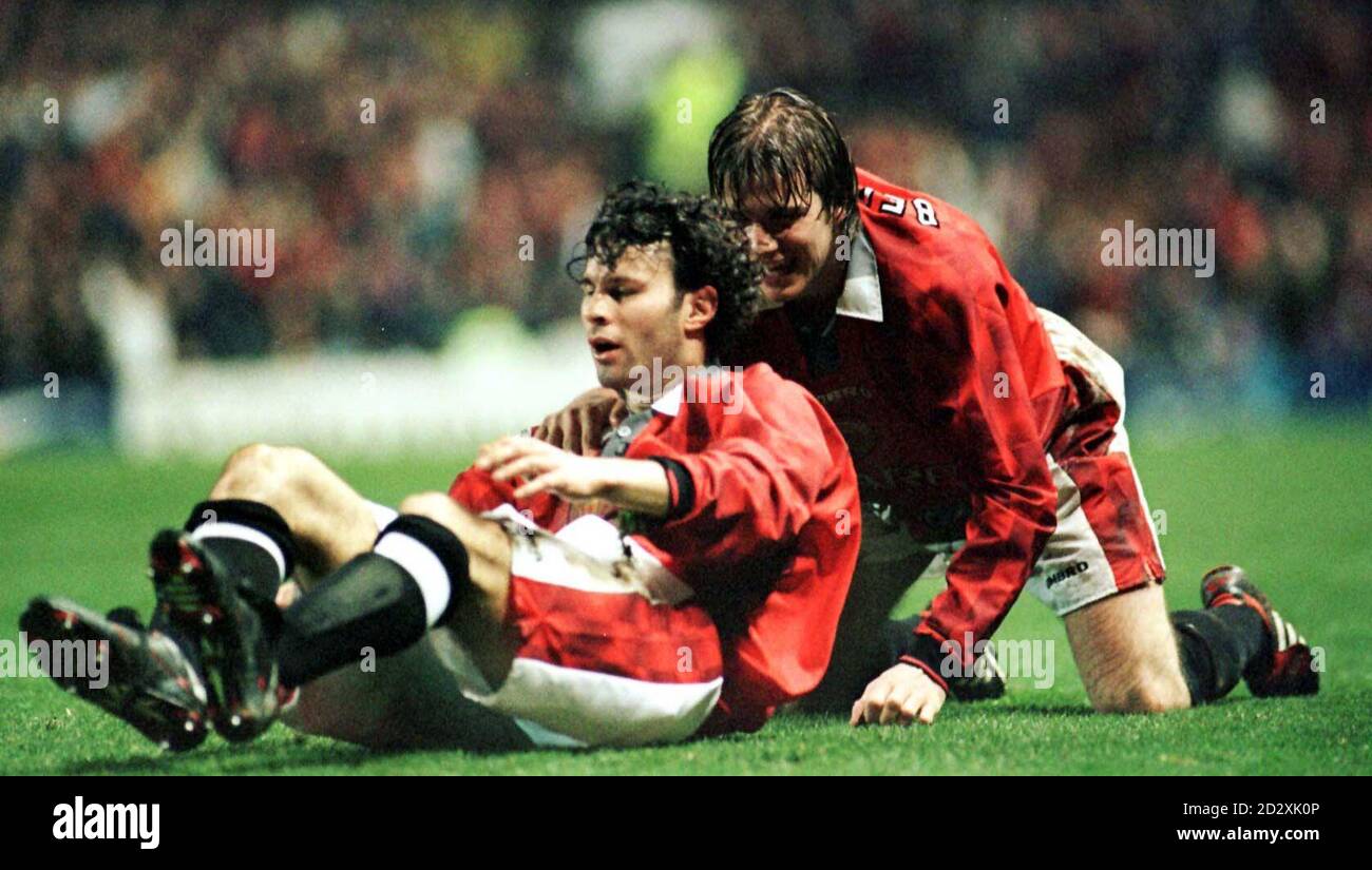 Ryan Giggs (left) and David Beckham celebrate after Giggs scores during ...
