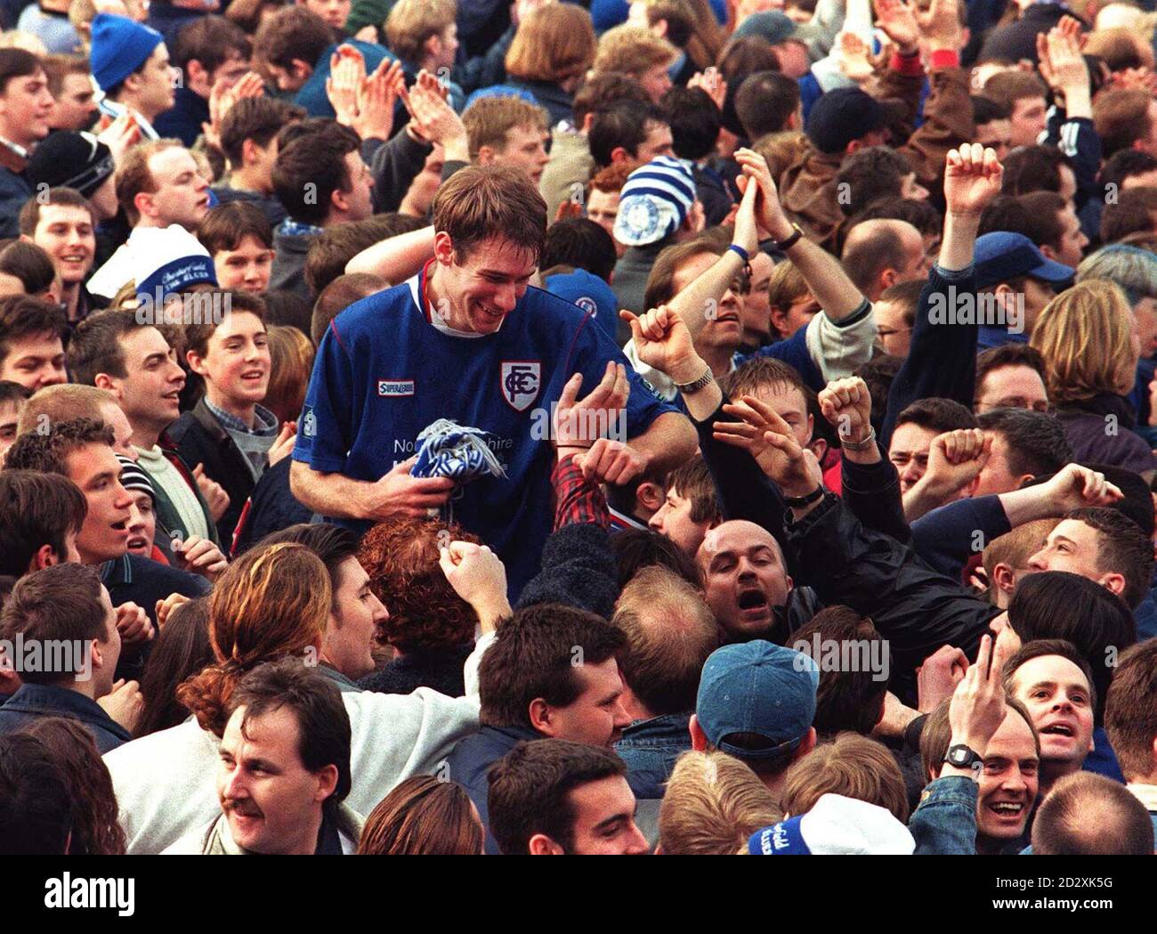 Party time at Chesterfield as fans carry off one of their players ...