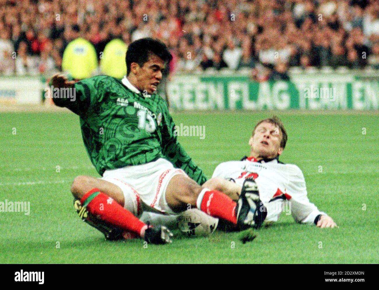 Pavel Pardo of Mexico brings down Teddy Sheringham in the penalty box ...