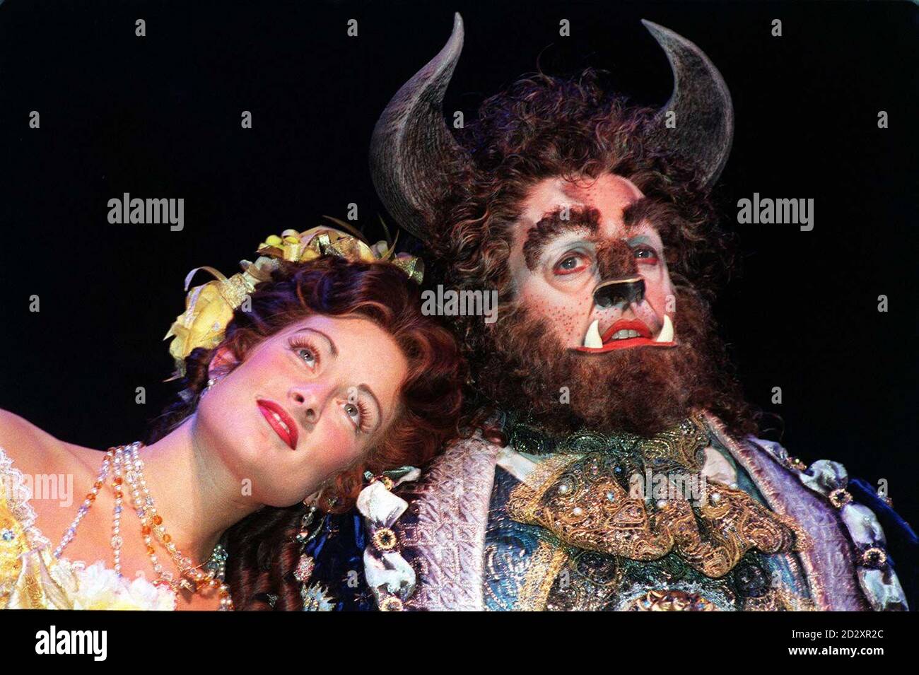 Julie-Alanah Brighten, as Belle, and Alasdair Harvey, as the Beast, in ...