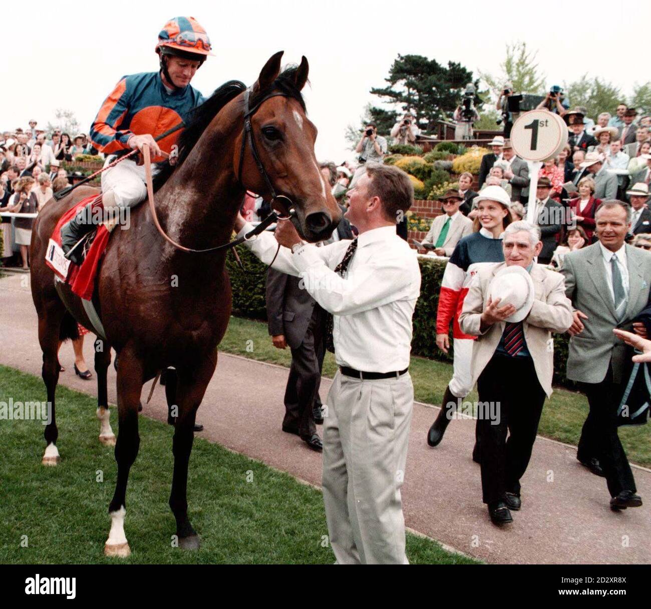 Entrepreneur with Michael Kinane up is led into the winners enclosure ...