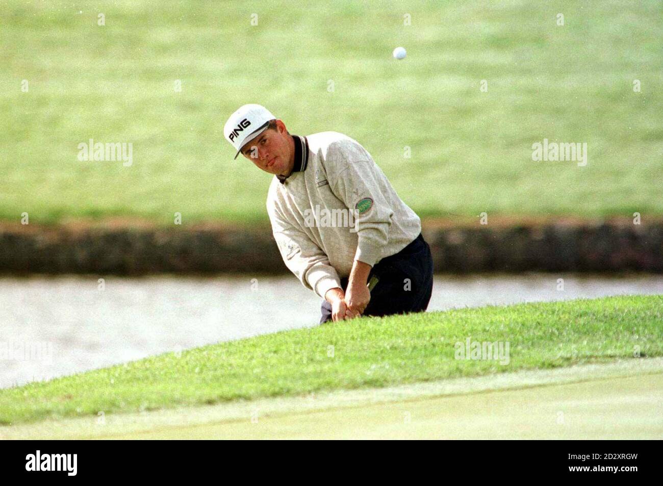 Lee Westwood chips on to the green at the 13th, during the second day ...