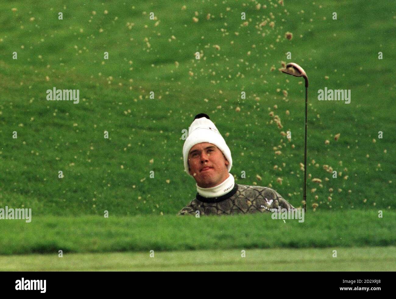 Lee Westwood blasts out of a bunker on the 2nd green during the third ...