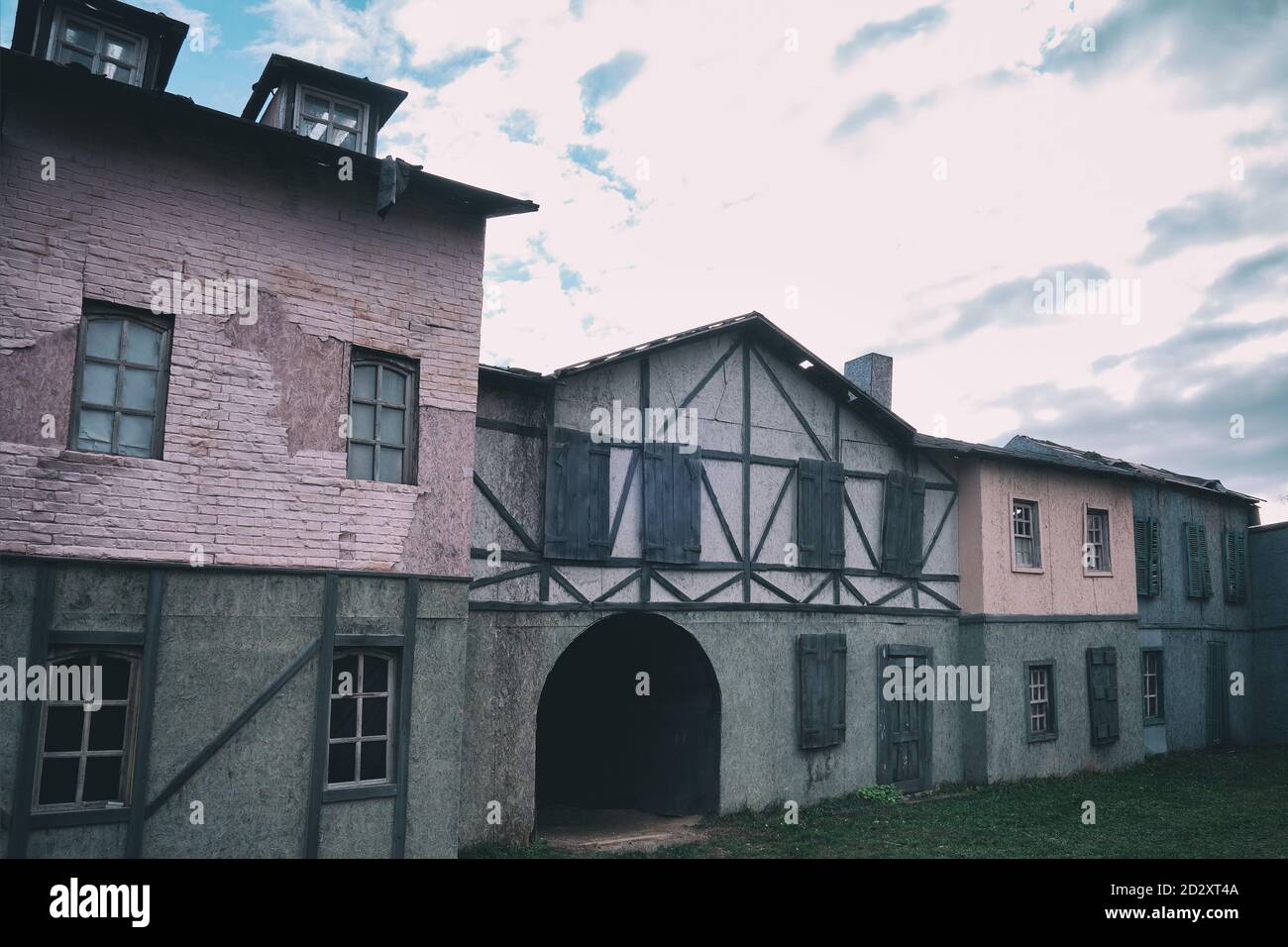 Old street with two-story houses in retro style of medieval Europe ...