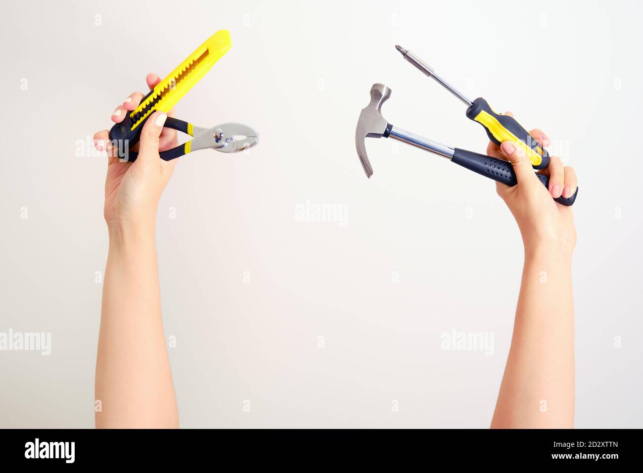 Construction tools at arm's length. Hammer, screwdriver, pliers, paper ...