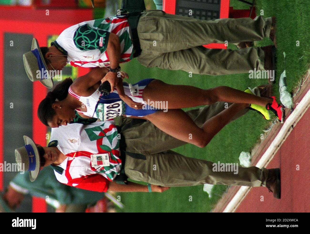 Britain's Diane Modahl is helped off the track this evening (Friday ...