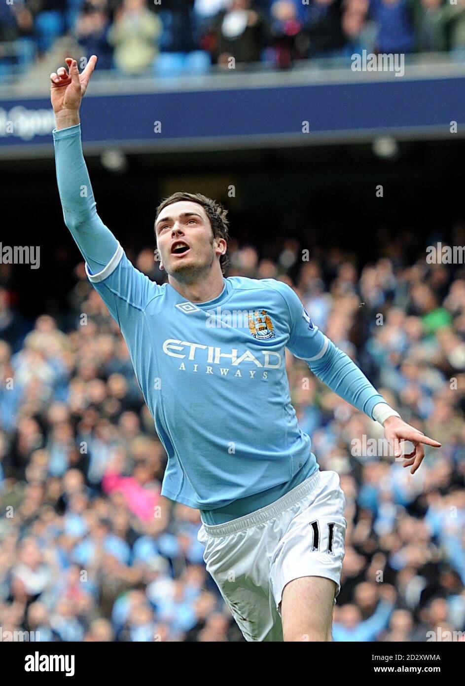 Manchester City's Adam Johnson celebrates scoring the opening goal ...
