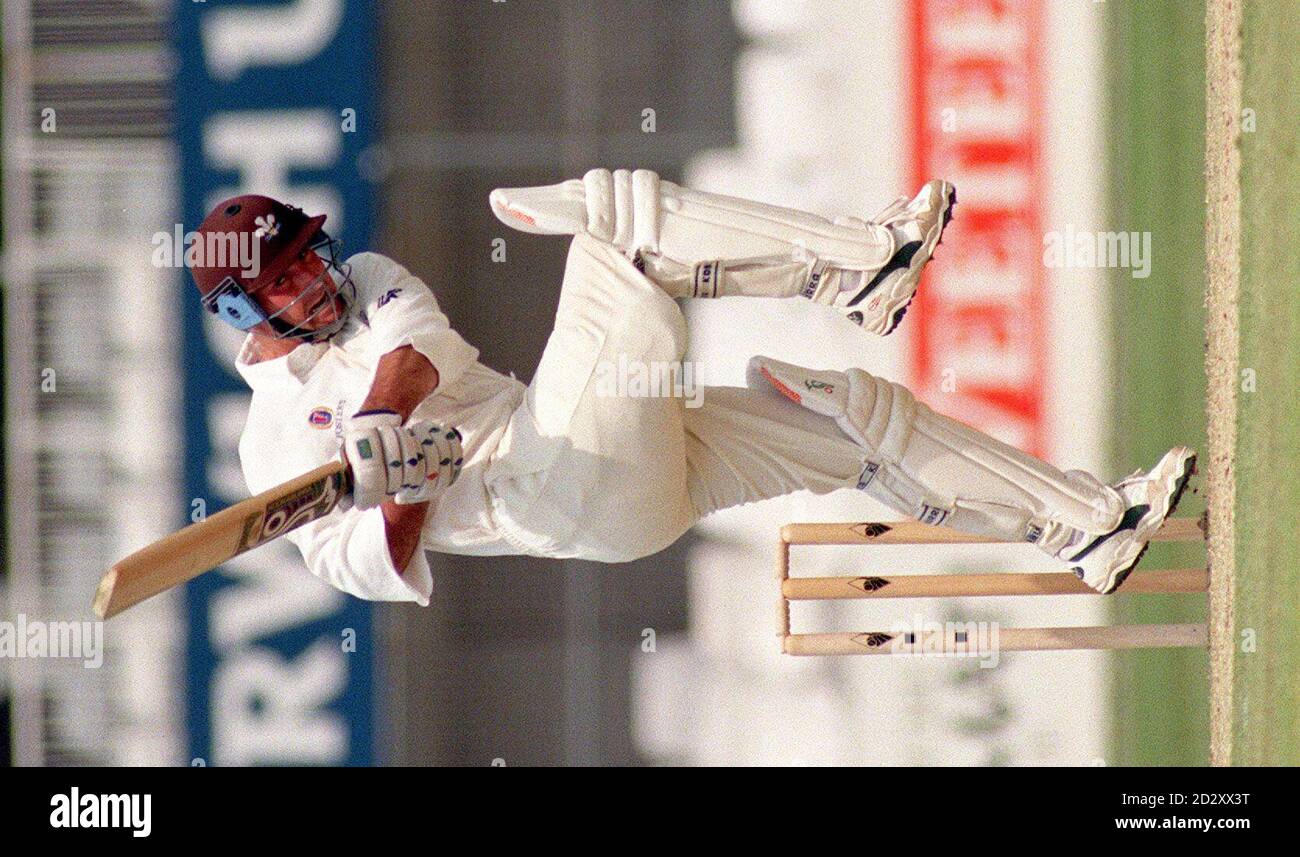 Surrey's Graham Thorpe cracks a ball from Leicestershire's Mullins to ...