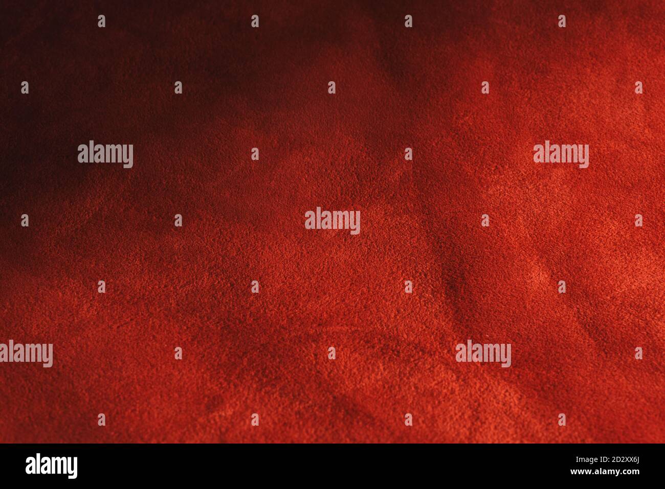 Red matte background of suede fabric, closeup. Velvet texture of ...