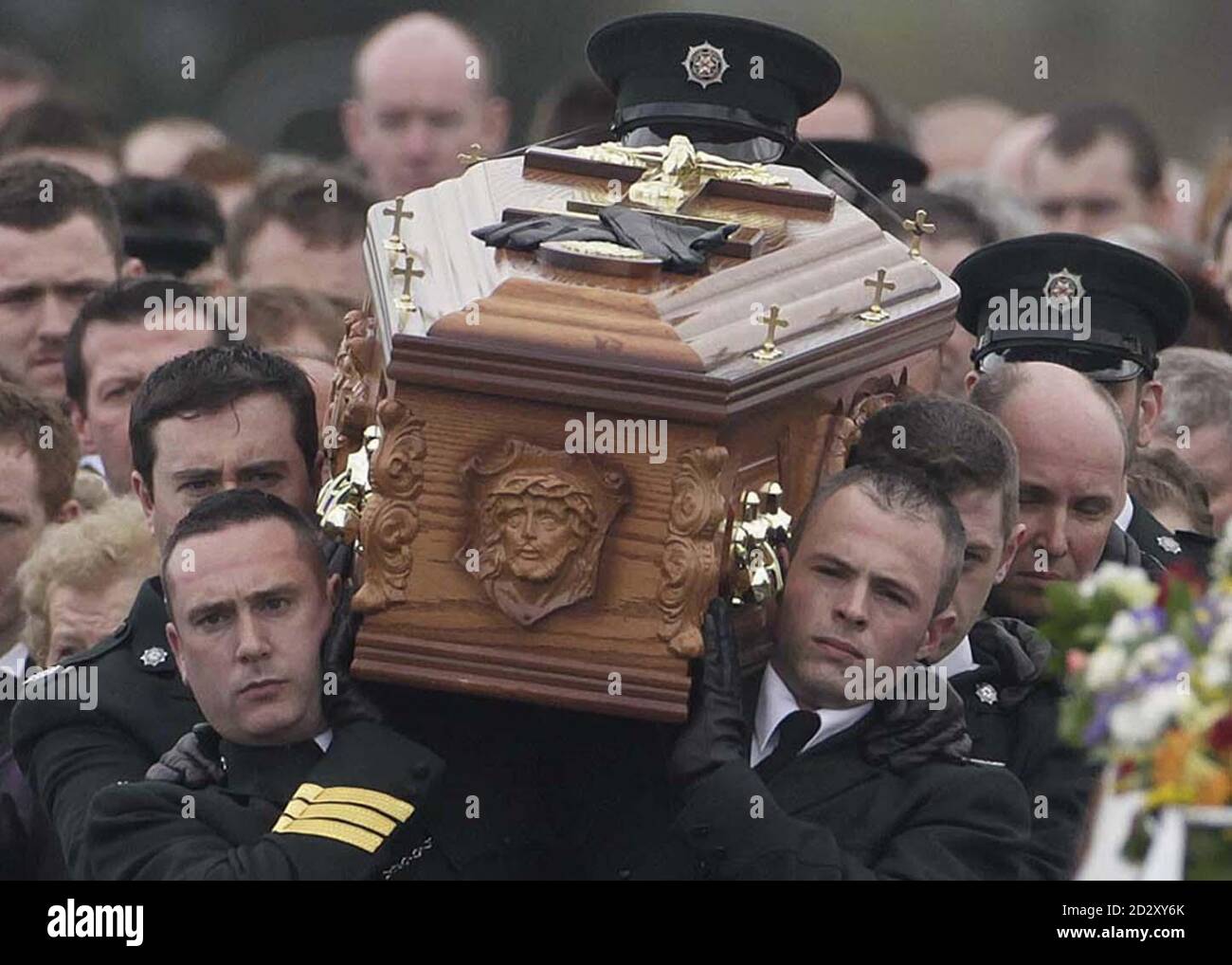 The coffin of PSNI Constable Ronan Kerr is carried through his home ...