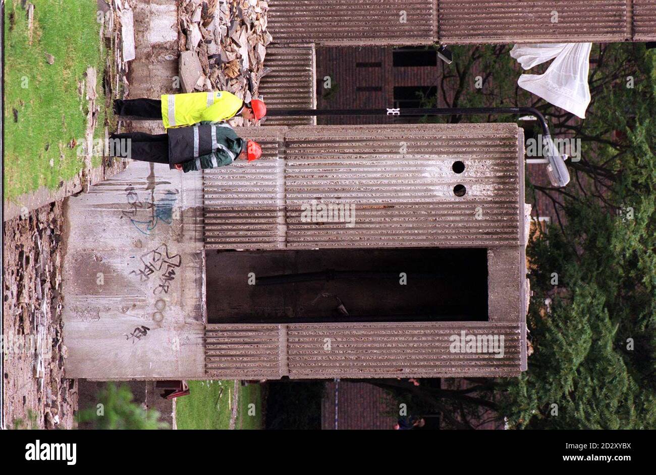 Experts inspect the area of the gas explosion which tore through a 21 ...