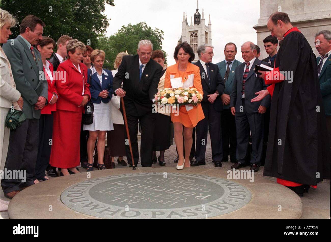 The Dean of Westminster, Canon David Hutt (far right) reads a prayer as ...