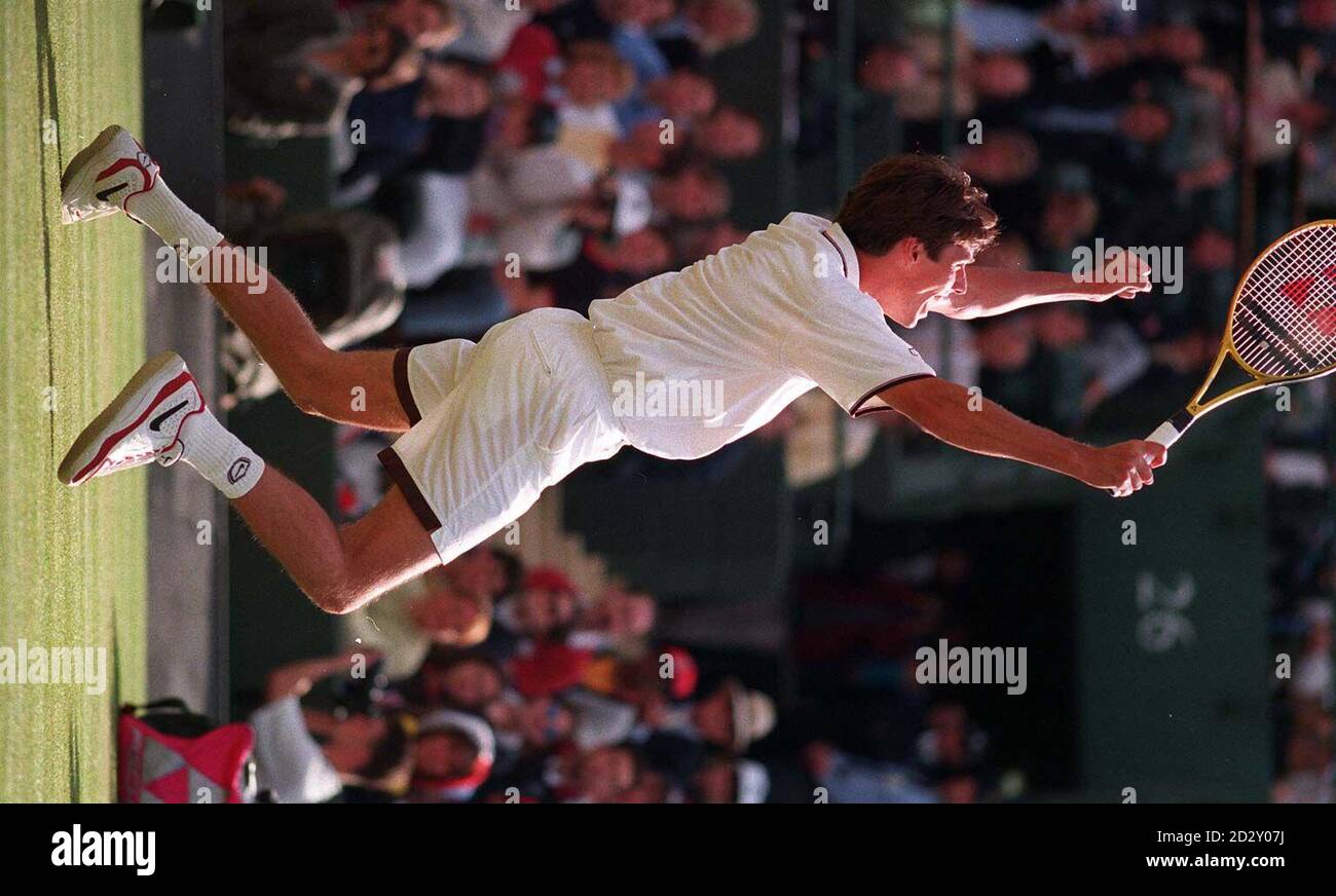 Michael Stich raises his arms in jubilation after beating Britain's Tim ...