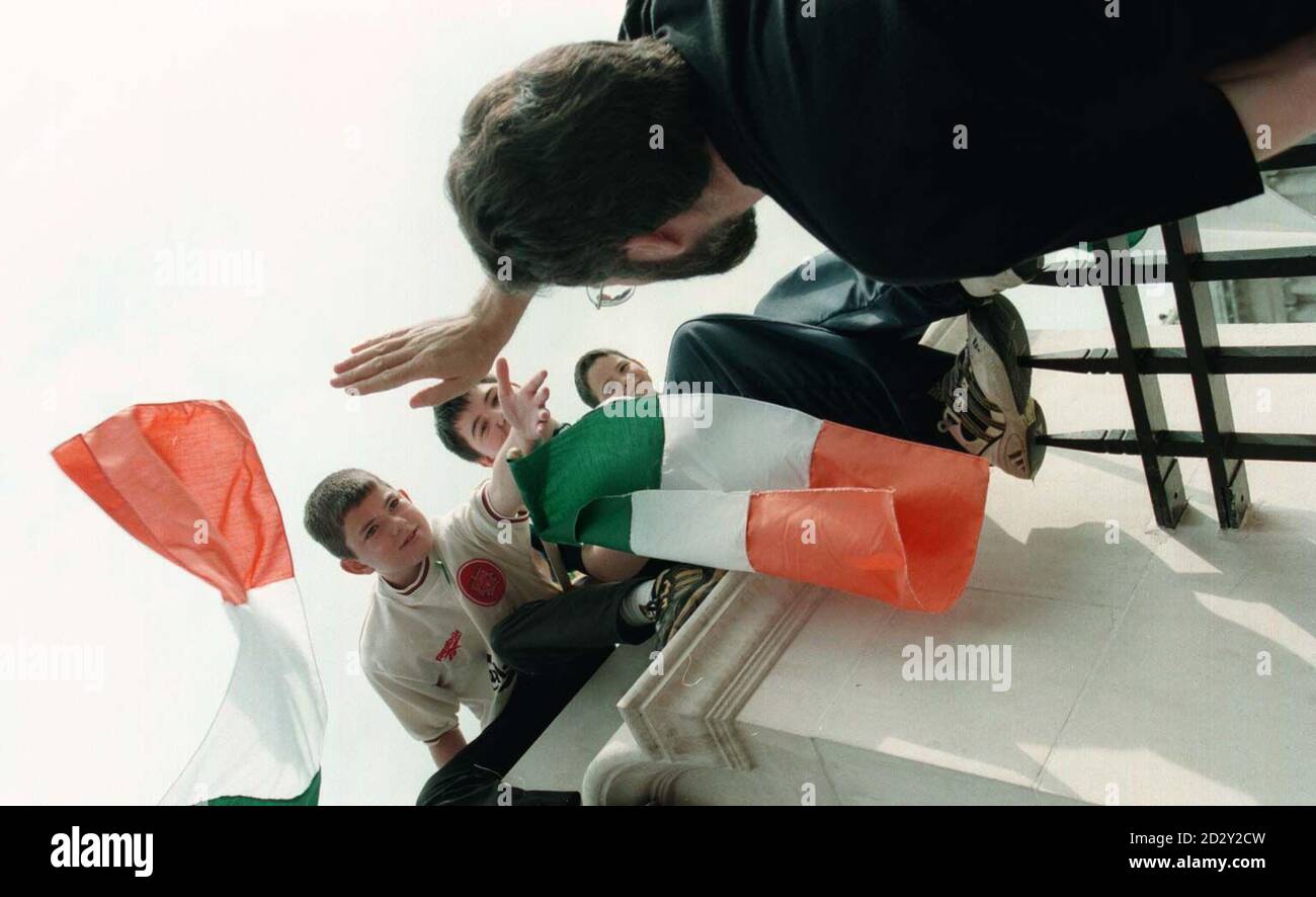 Garry Adams gives a high 5's to young Sinn Fein supporters at the 26th ...