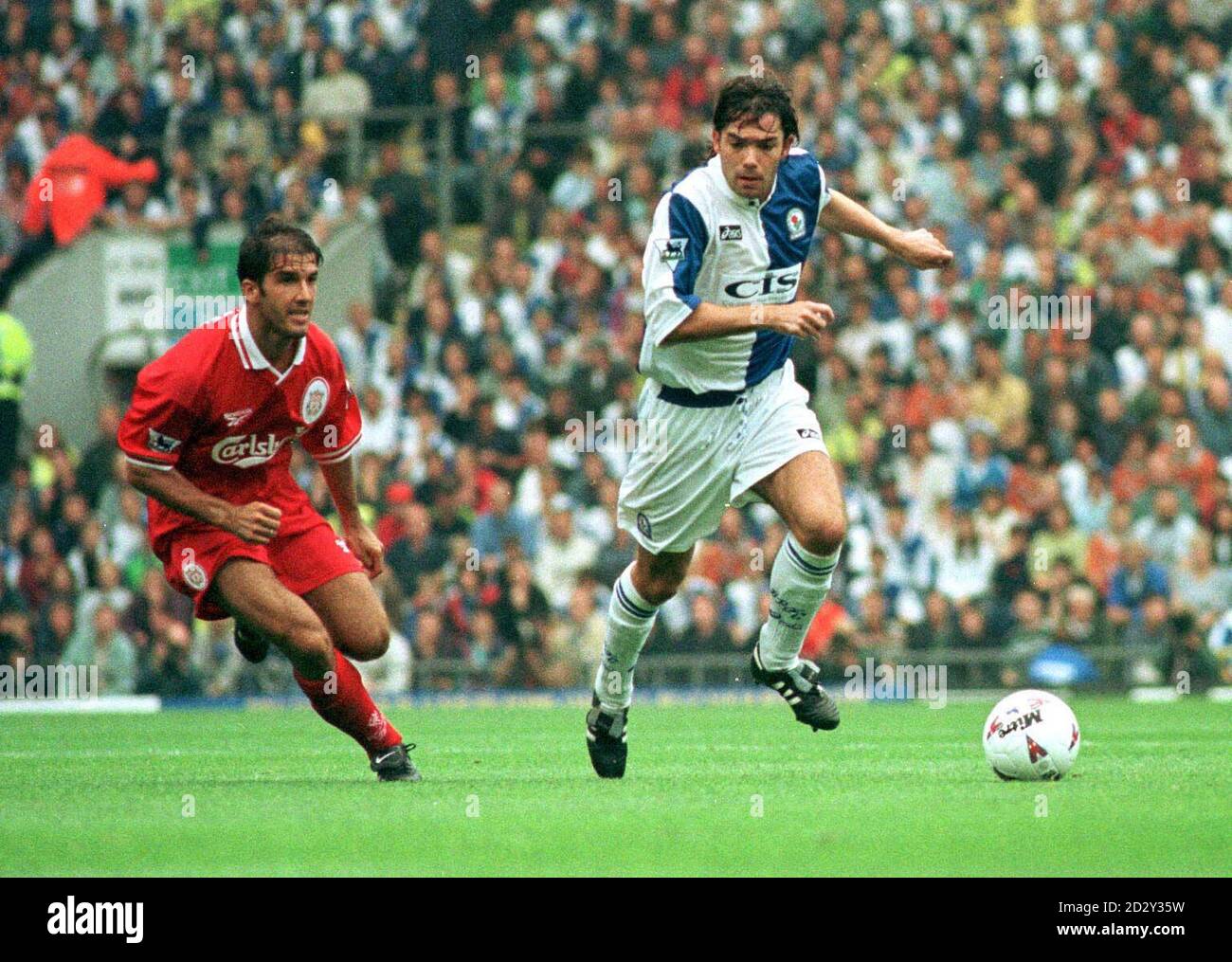 Blackburn's Jeff Kenna (right) moves past the Liverpool defence during ...