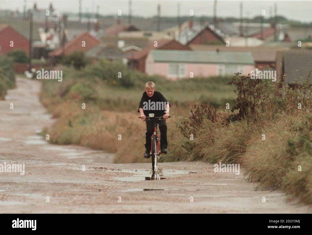 A policeman's 13-year-old son, Peter Lovewell, wearing clothes ...