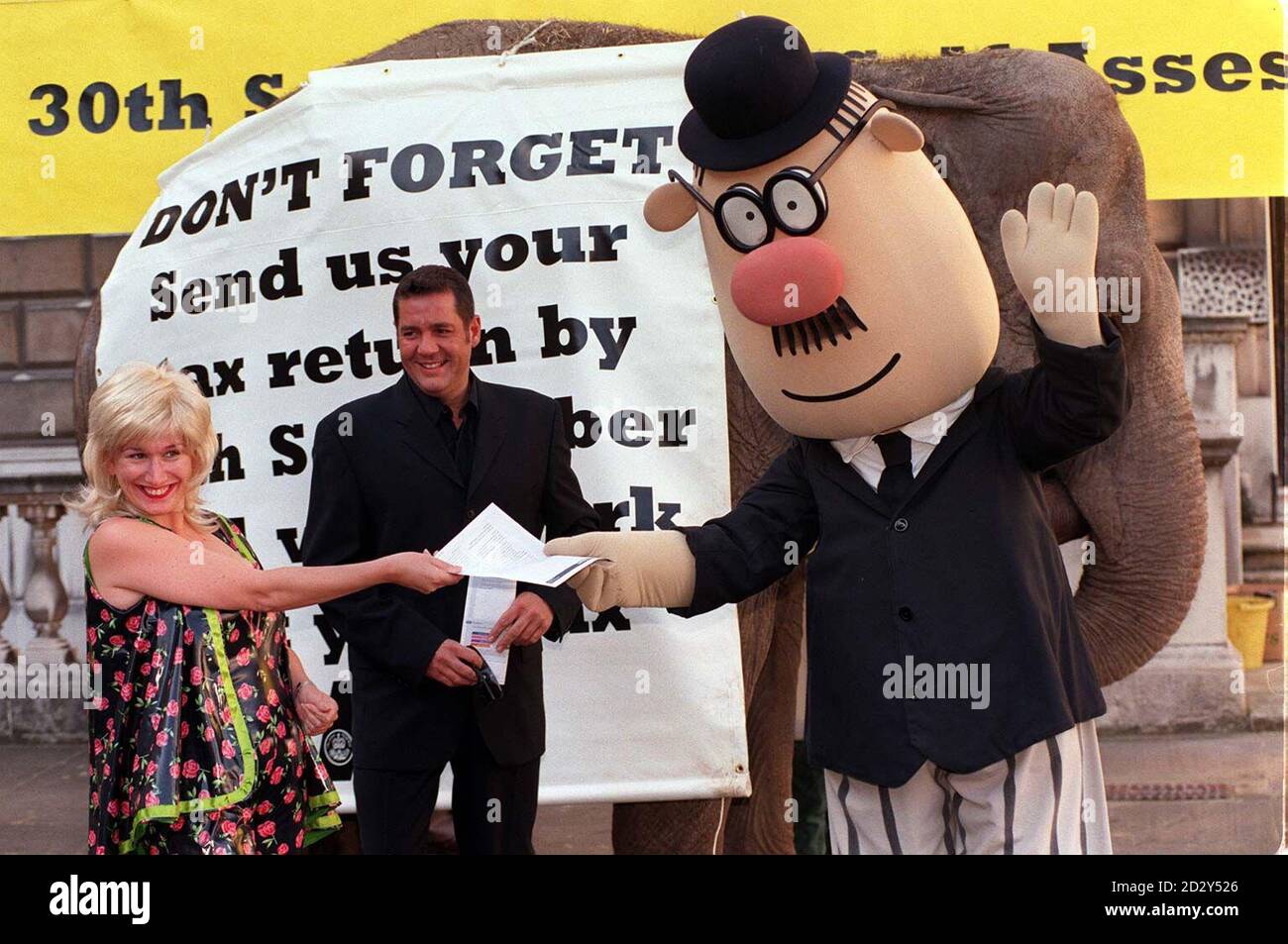 TV show host, Dale Winton (centre) and comedienne, Gayle Tuesday hand ...