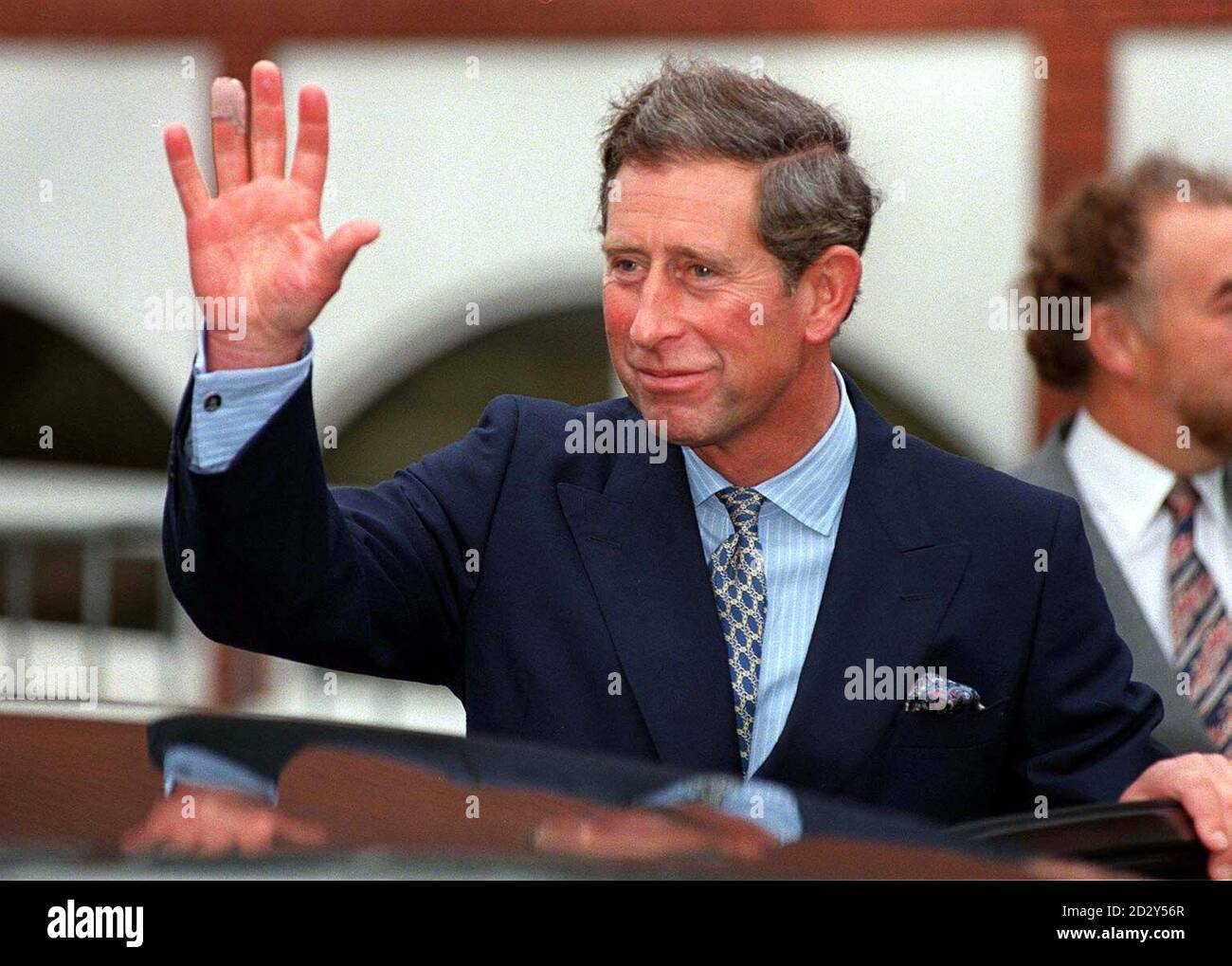 Prince Charles waves to crowds of well-wishers during his visit to ...