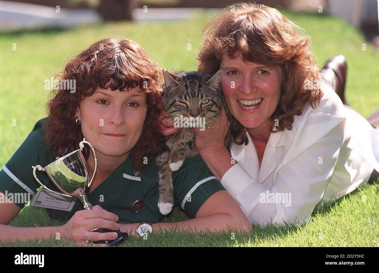 Silver, the stray tabby, with his owner Iris Johnson-Smith (right) and ...