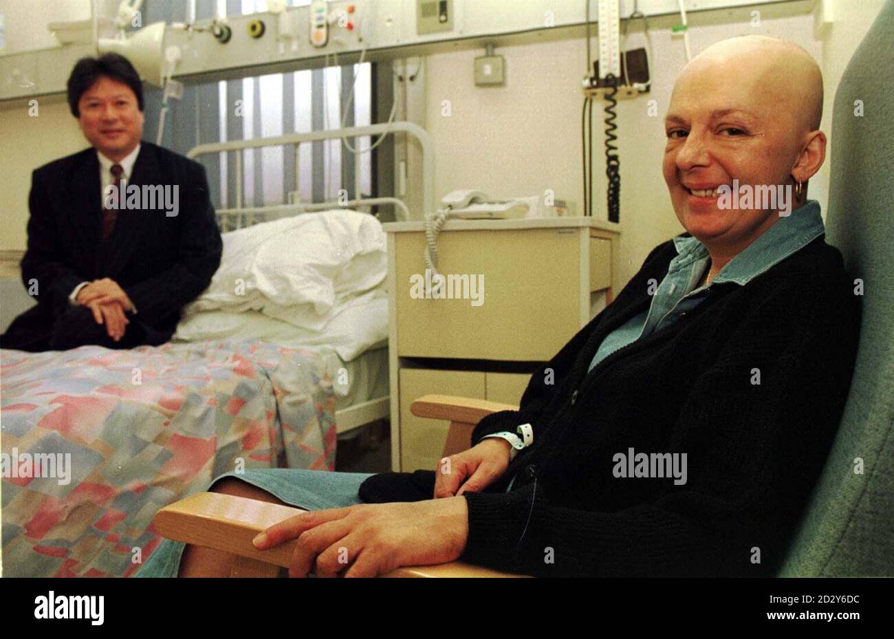 Smiling leukaemia sufferer Angela Latham with Doctor John Yin who ...