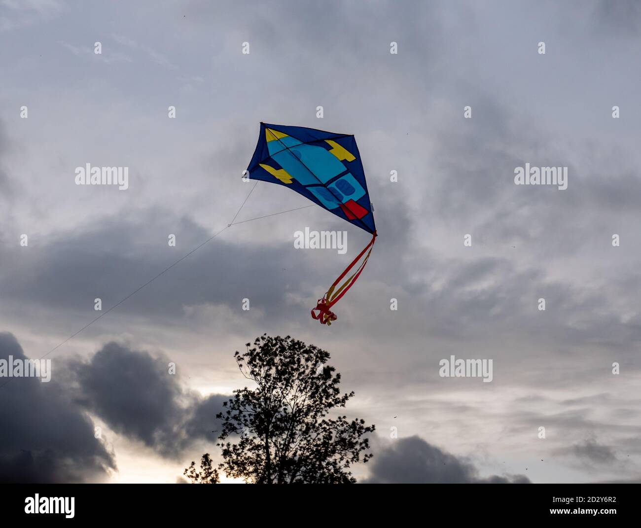Kites fly in autumn under gray skies Stock Photo - Alamy