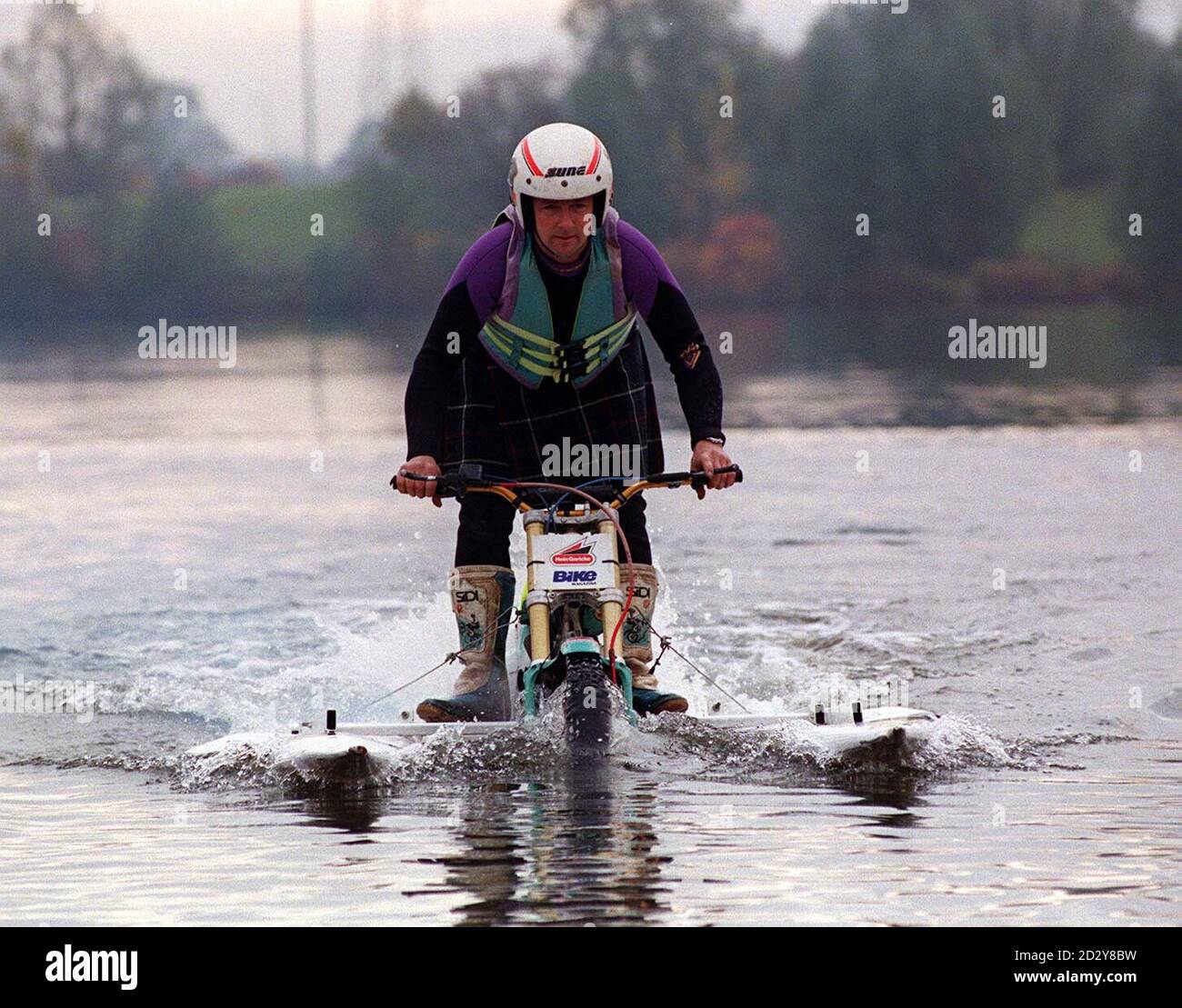 A kilted Gordon Halley of Perth skims around the NEC lake during the ...