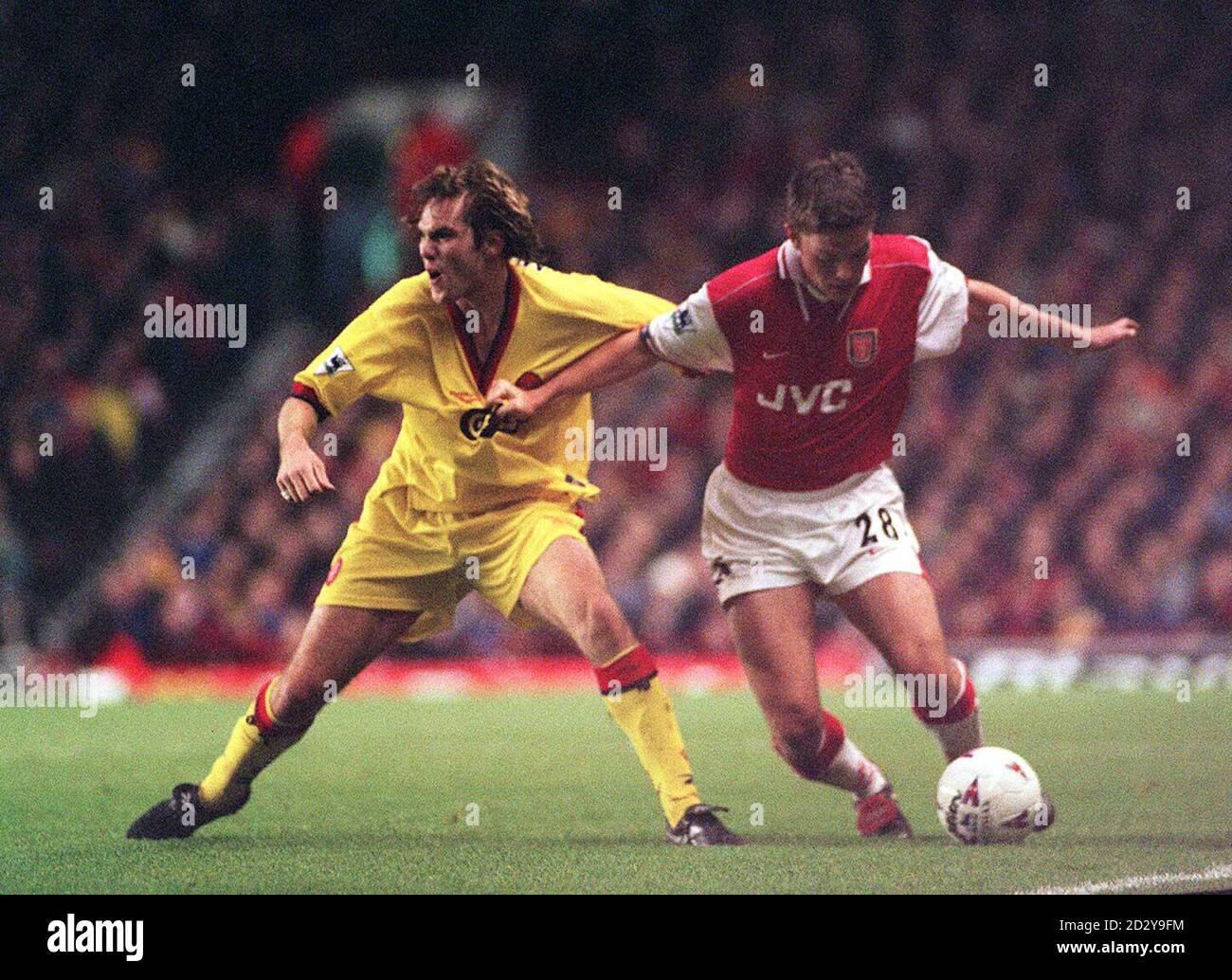 Arsenal's Stephen Hughes (right) and Liverpool's Jason McAteer in mid ...