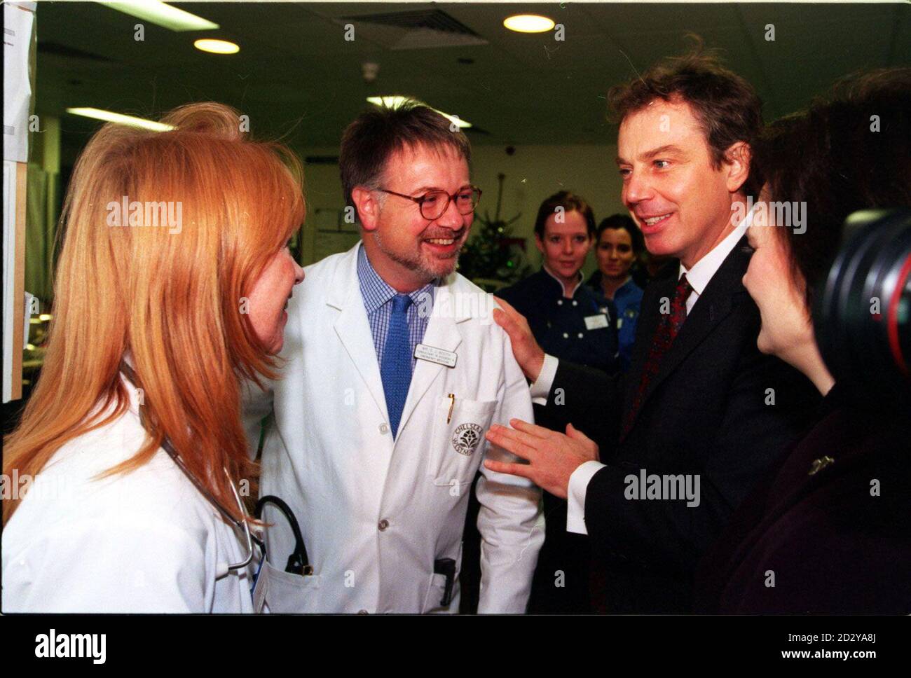 Prime Minister Tony Blair and his wife Cherie (front right) speak to Dr ...