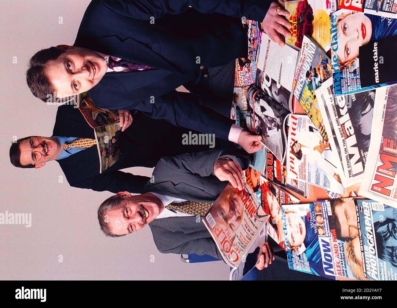 Brian Linden (right) and Dick Munton (centre) of Cinven, browse through ...