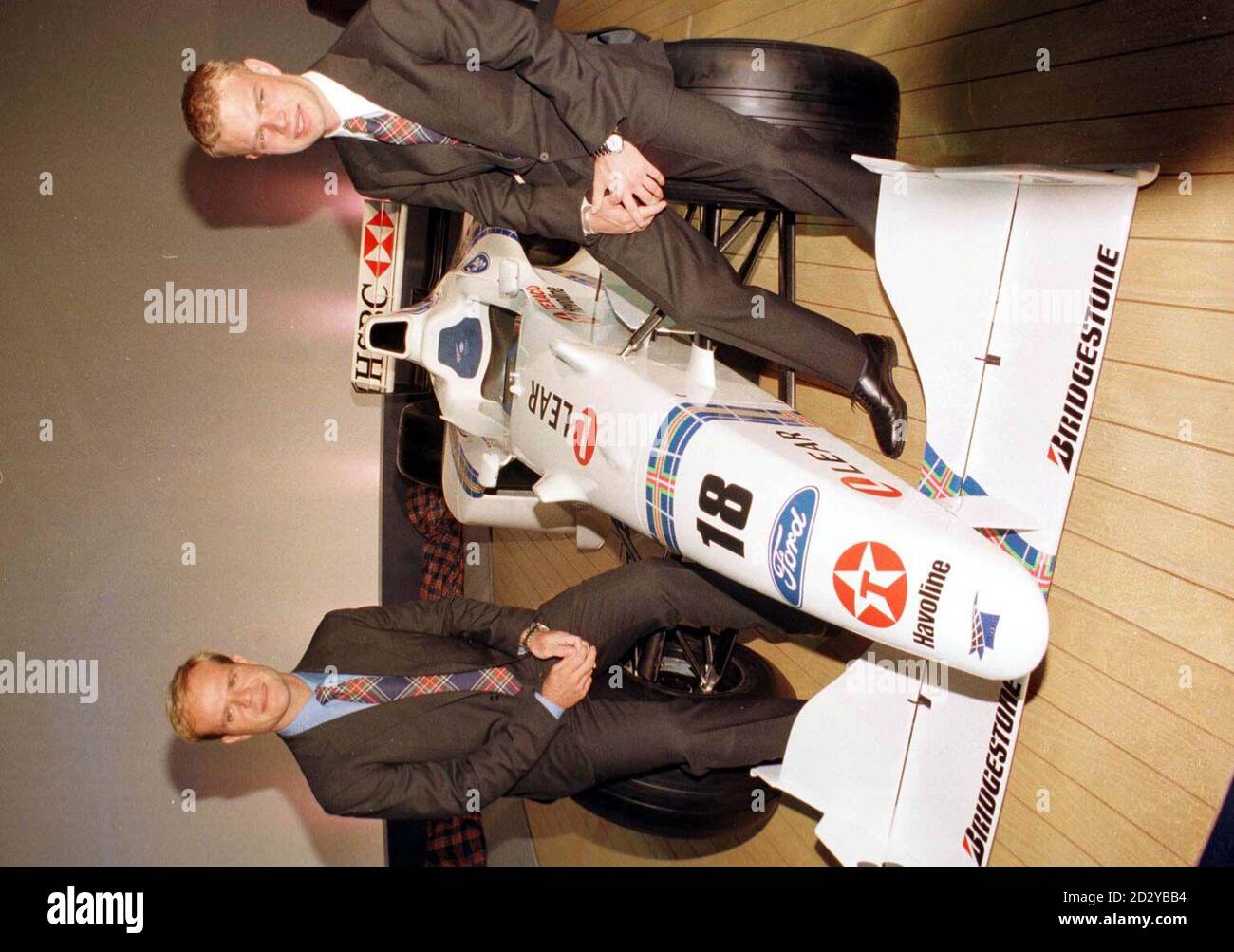 The Stewart Ford driver's Rubens Barrichello and Jan Magnussen (right ...