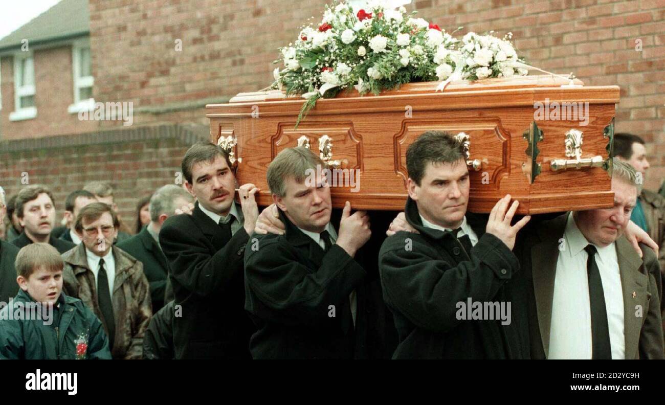 The coffin of Catholic taxi driver, John McColgan, is carried from his ...