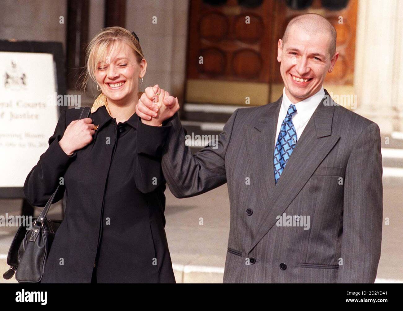 Former Royal Marine Graham Pearson and his wife, Rose, smile and clasp ...