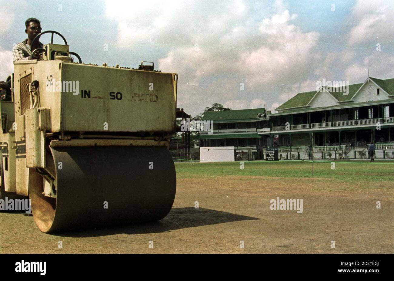 A large mechanical roller is used to prepare the pitch at the Bourda ...