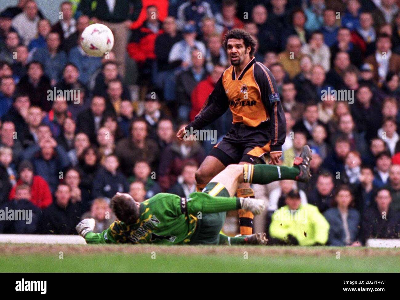 Don Goodman of Wolves beats Leeds goalkeeper Nigel Martyn to score the ...