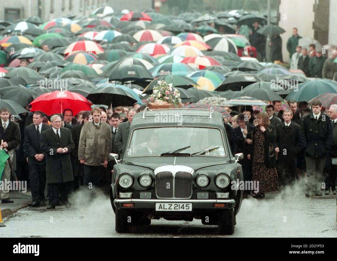 Hundreds of mourners follow the coffin of Philip Allen through ...