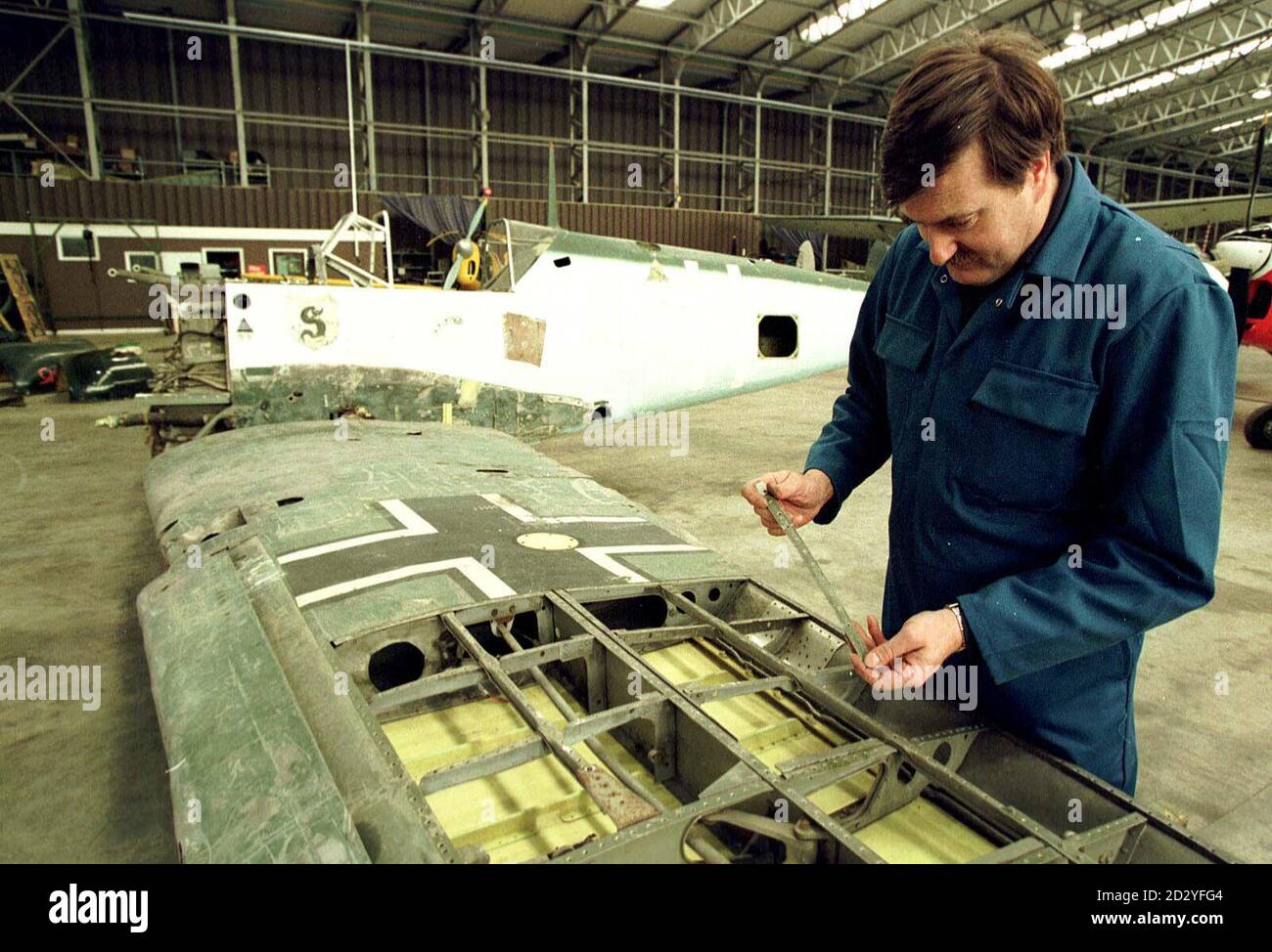 Restoration engineer at the Imperial War Museum Colin Swann, examines ...