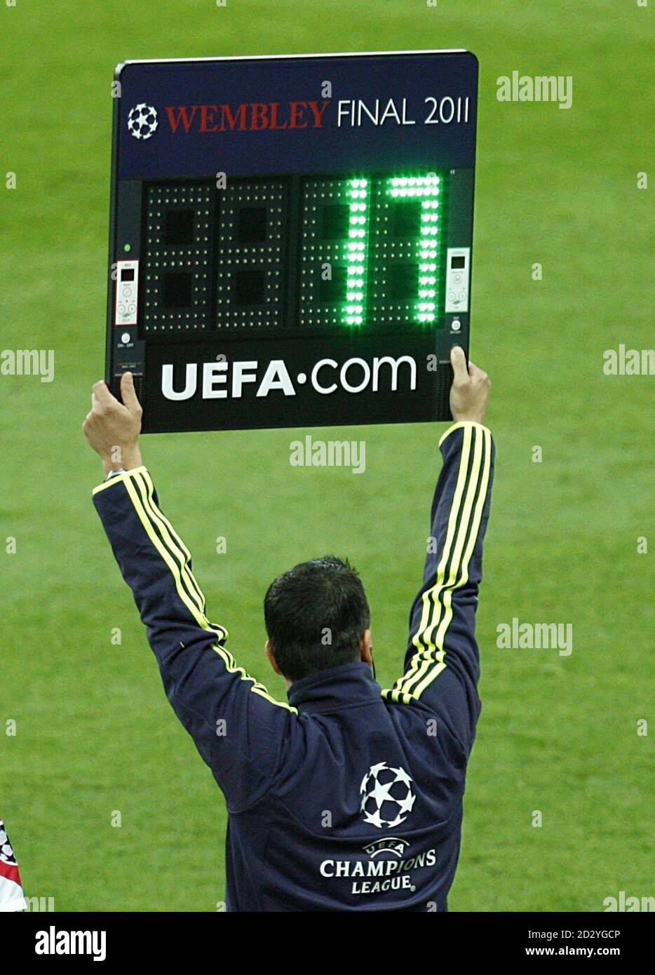 The fourth official holds up the substitution board Stock Photo - Alamy