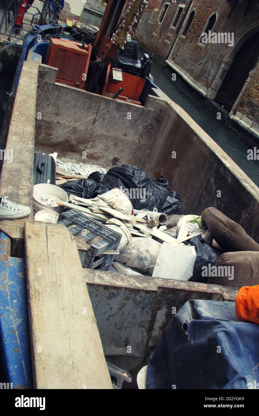 Recycle of rubbish and trash and municipal service concept. Boat with ...