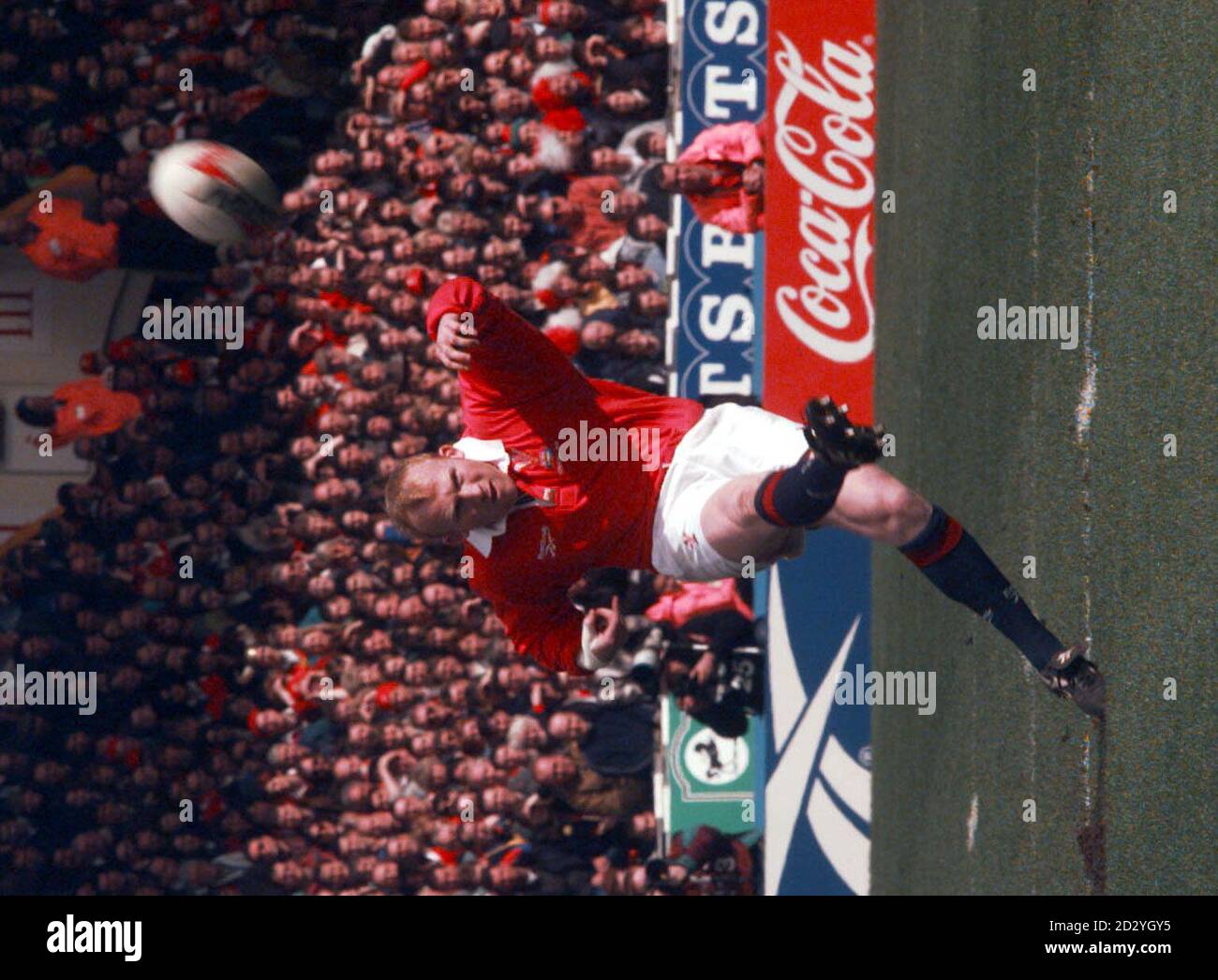 Wales Stand off Neil Jenkins attempts a drop goal during today's ...